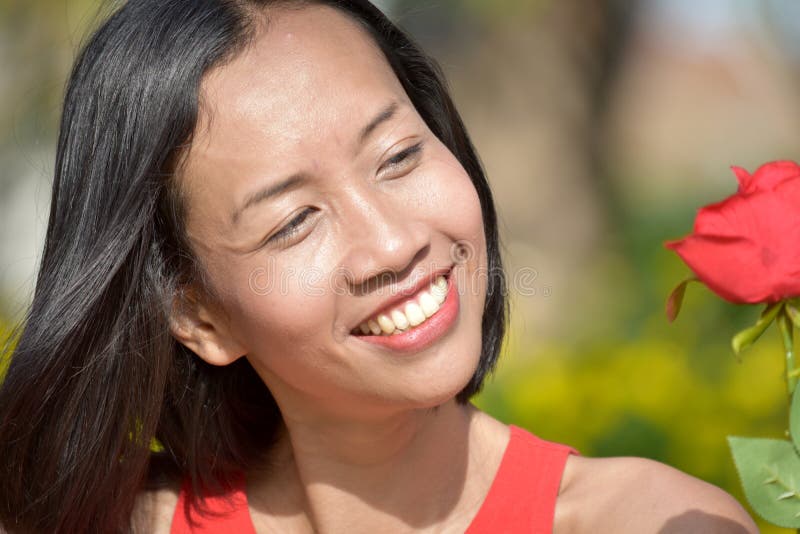 Smiling Filipina Female with a Rose Stock Image - Image of flowers ...