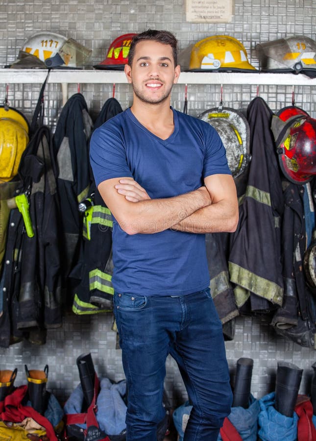 Smiling Firefighter Standing at Fire Station Stock Photo - Image of ...