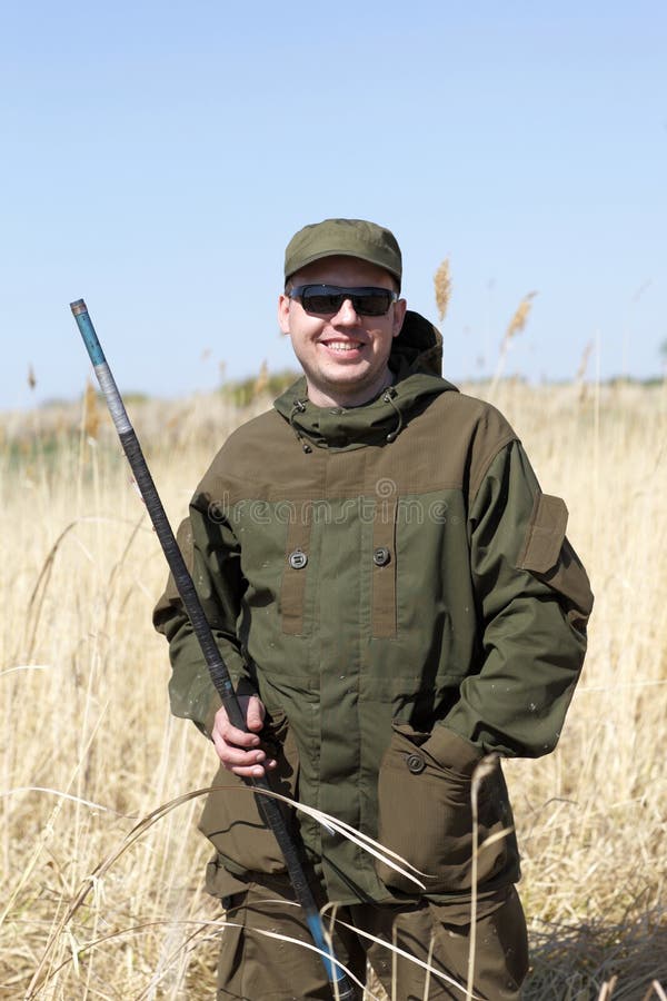 Smiling fisherman on field stock image. Image of equipment - 25276603