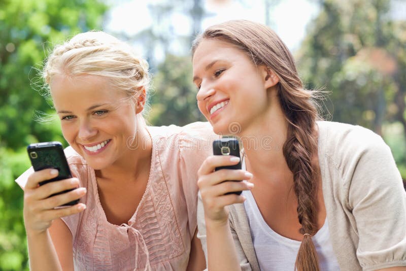 Group of Friends Using Their Smart Phones Stock Photo - Image of people ...