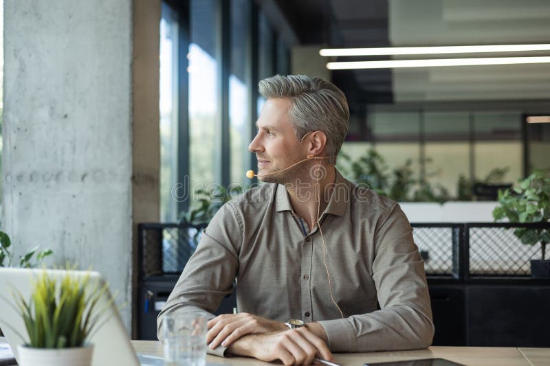 Male Call Center Operator or Telesales Agent Working on His Desk ...