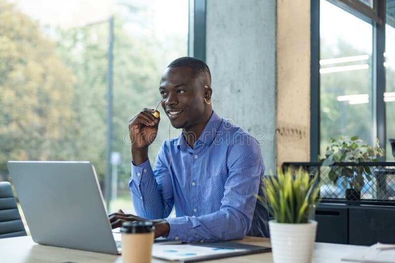 Male Call Center Operator or Telesales Agent Working on His Desk ...