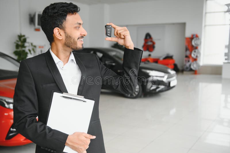 Smiling, Friendly Indian Car Seller Standing in Car Salon. Stock Image ...