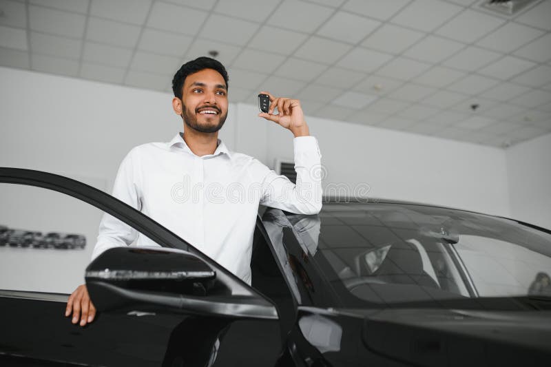 Smiling, Friendly Indian Car Seller Standing in Car Salon. Stock Photo ...