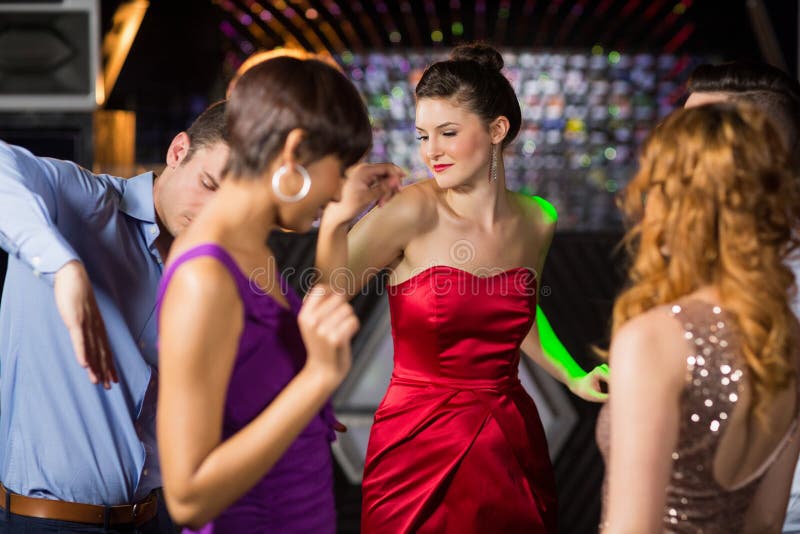 Smiling Friends Dancing on Dance Floor Stock Photo - Image of activity ...