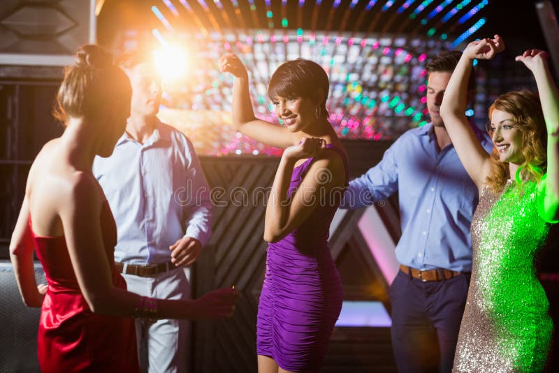 Smiling Friends Dancing on Dance Floor Stock Image - Image of enjoyment ...