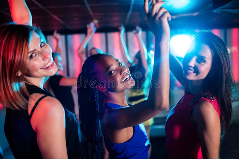 Smiling Friends Dancing on Dance Floor Stock Photo - Image of dance ...