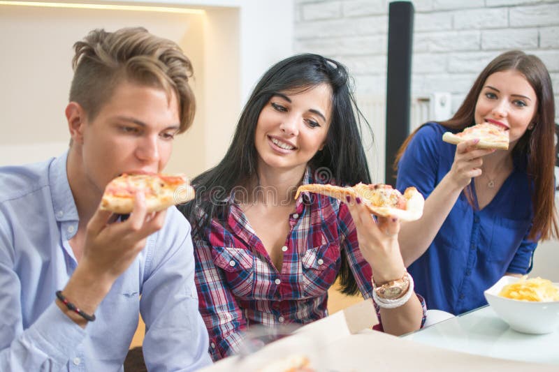 Smiling Friends Eating Pizza at Home. Stock Photo - Image of eating ...