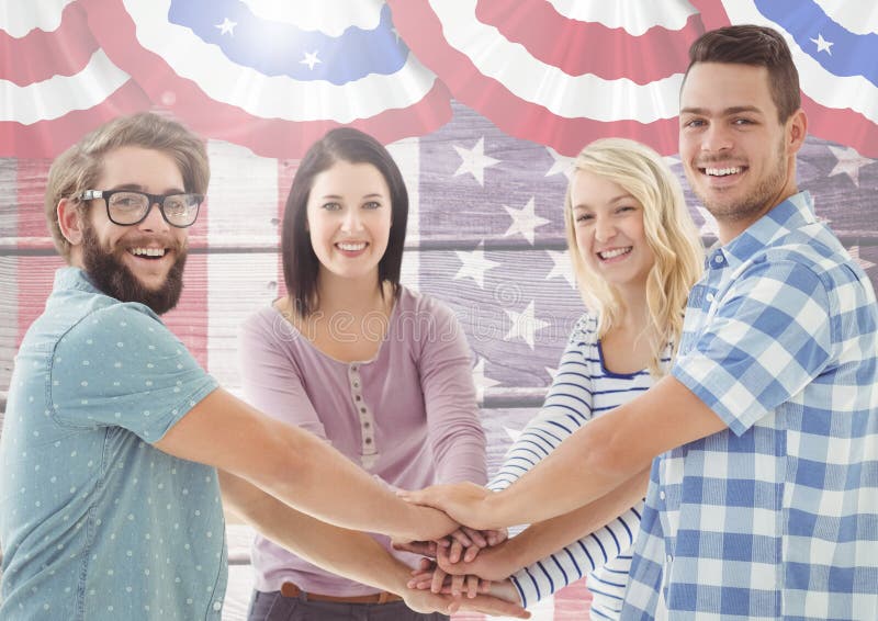 Smiling Friends with Hands Together Against American Flag Stock Photo ...