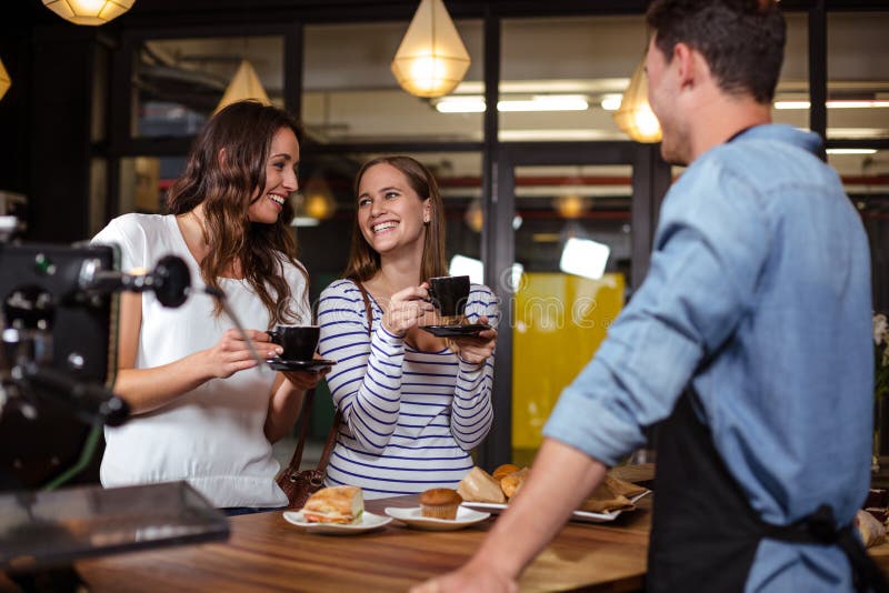 Smiling Friends Having Coffee Stock Photo - Image of food, drink: 66983906