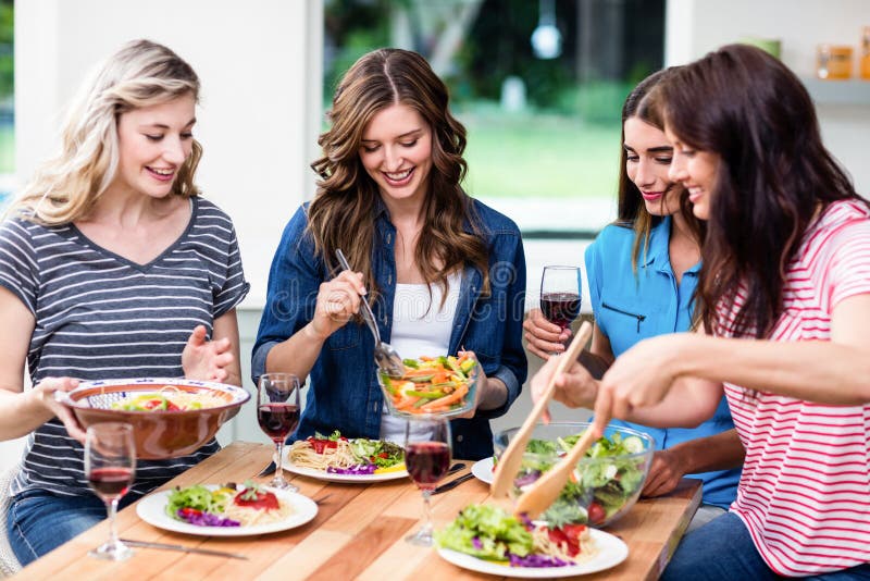 Smiling Friends Having Food Stock Image - Image of friendship, love ...