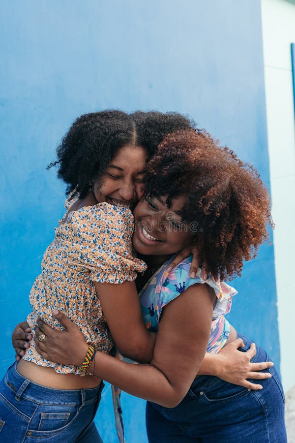 Smiling Friends Hugging Each Other while on the Street Stock Image ... Smiling Friends Hugging Each Other while on the Street Stock Image ...