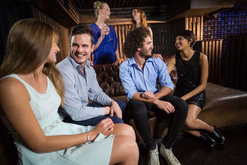 Smiling Friends Interacting with Each Other Stock Photo - Image of ...