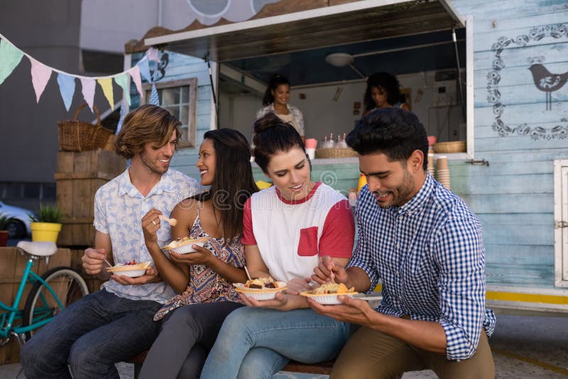 Friends Interacting while Having Snacks Stock Image - Image of ...