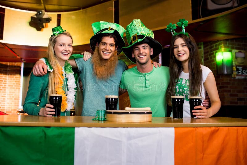 Smiling Friends with Irish Accessory Stock Photo - Image of glass, flag ...