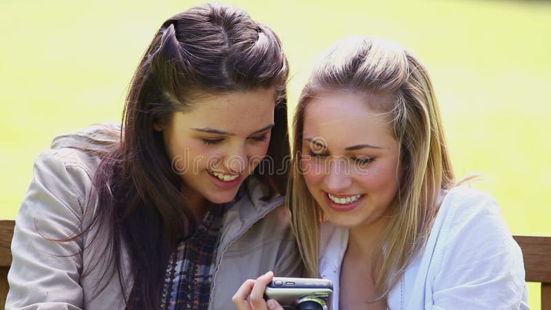 Smiling Friends Looking at a Digital Camera Stock Footage - Video of ...