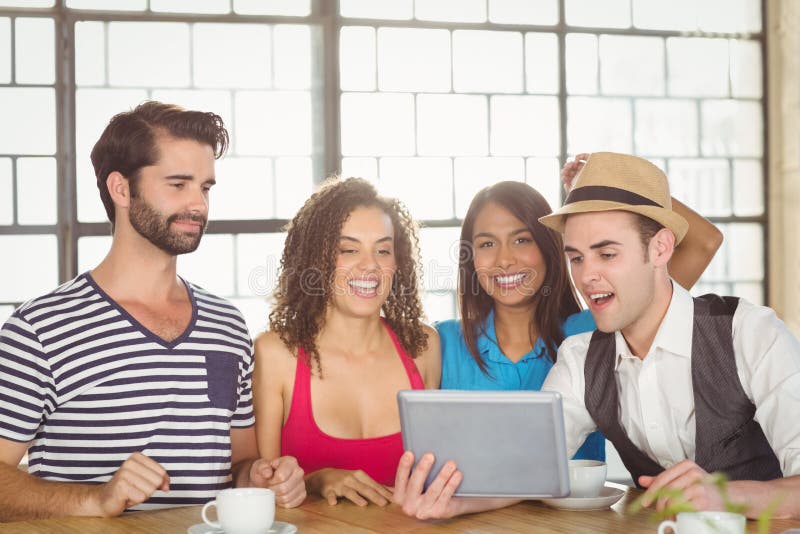 Smiling Friends Looking at Tablet Computer Stock Image - Image of break ...