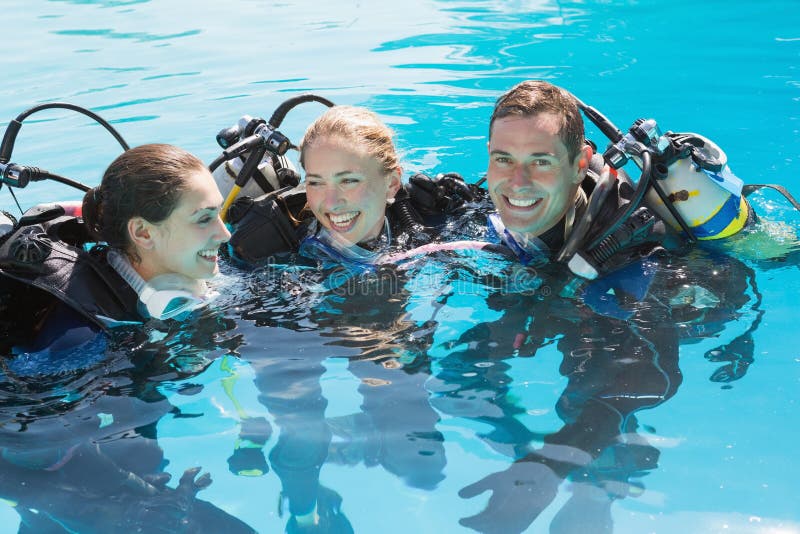 Friends on Scuba Training Submerged in Swimming Pool Two Looking To ...