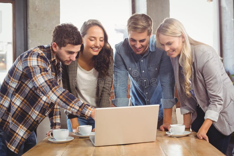 Smiling Friends Standing and Pointing on Laptop Screen Stock Image ...