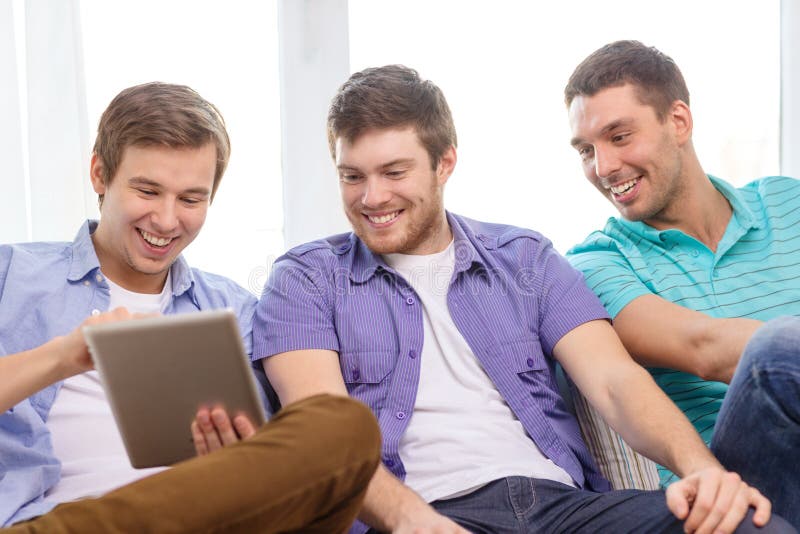 Smiling Friends with Tablet Pc Computers at Home Stock Photo - Image of ...
