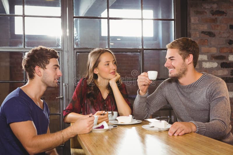Smiling Friends Talking and Enjoying Coffee and Cake Stock Photo ...