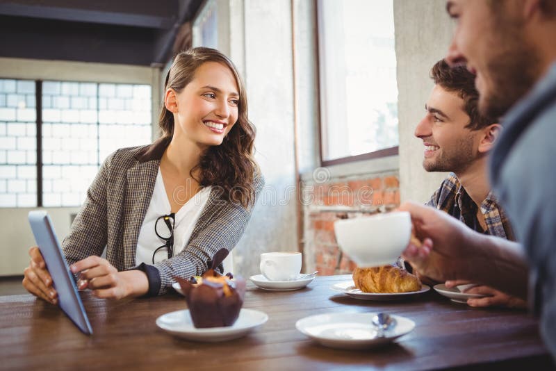 Smiling Friends Using Tablet Computer Together Stock Image - Image of ...