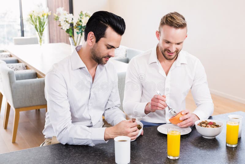 Smiling Gay Couple Having Breakfast Stock Image - Image of casual, home ...