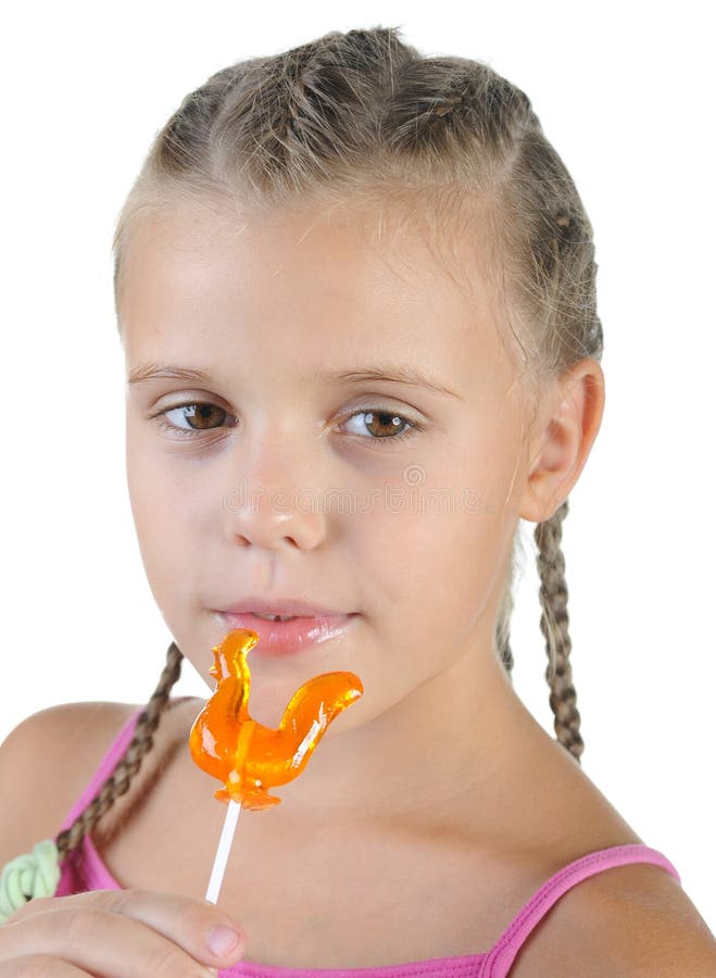 Smiling girl with candy. stock photo. Image of isolated - 15551248