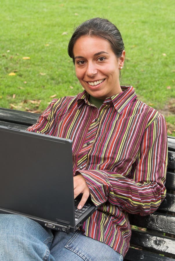 Smiling girl with computer stock photo. Image of college - 1356794