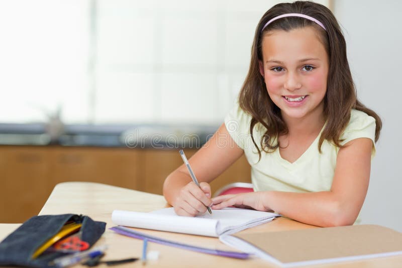 Smiling Girl Doing Homework in the Kitchen Stock Image - Image of ...
