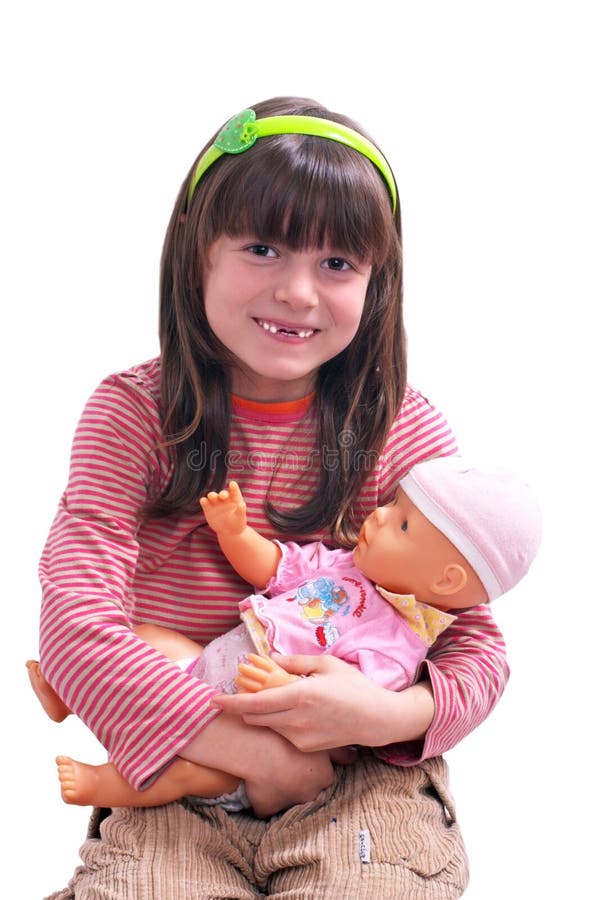 Smiling girl with doll stock image. Image of face, cuddle - 18461665
