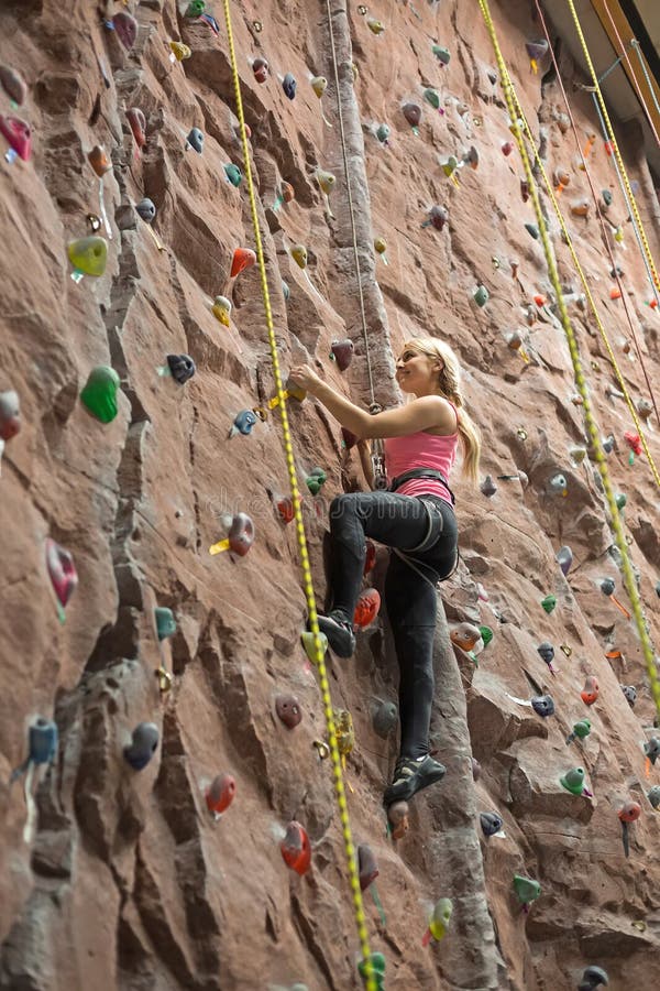 Couple Practicing Rock-climbing on a Rock Wall Stock Image - Image of ...