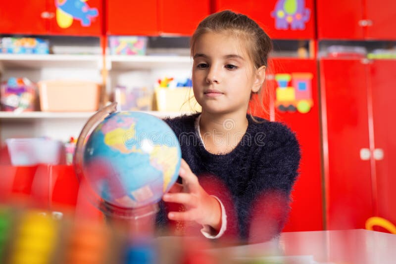 Smiling Girl Exploring Globe Stock Image - Image of planet, cute: 82048533