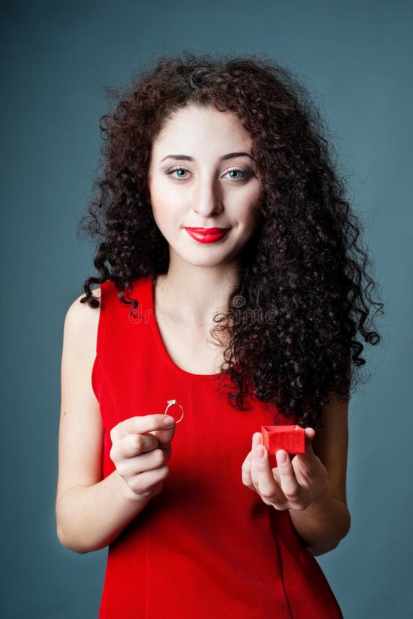 Smiling Girl Getting Out a Ring from a Red Gift Box Stock Photo - Image ...