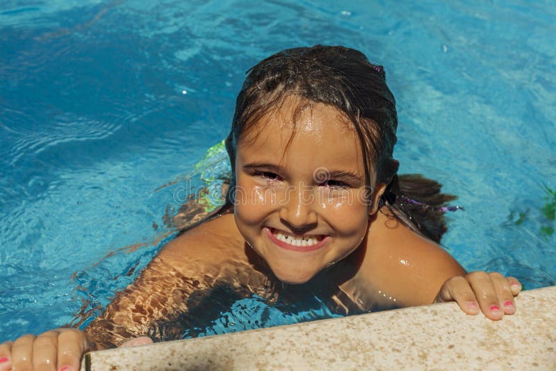 Smiling Girl Getting Out of the Water in the Pool. Stock Image - Image ...