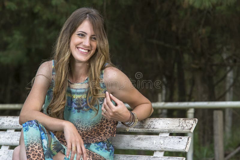 Smiling girl on a bench stock photo. Image of cute, face - 50897586