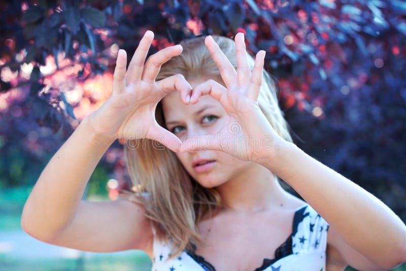 Smiling Girl with Heart Sign Stock Photo - Image of love, beautiful ...