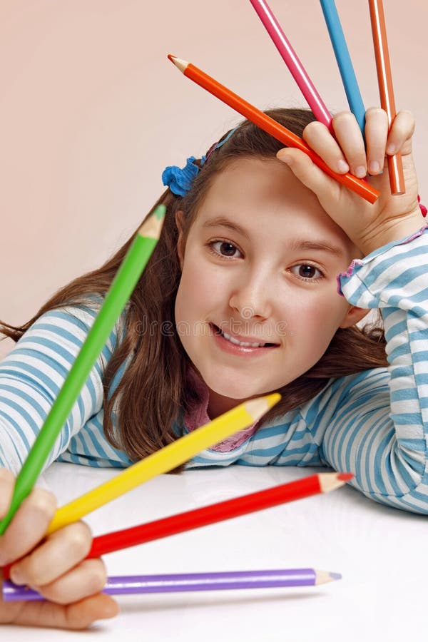 Smiling Girl Holding Color Pencils Stock Photo - Image of beautiful ...