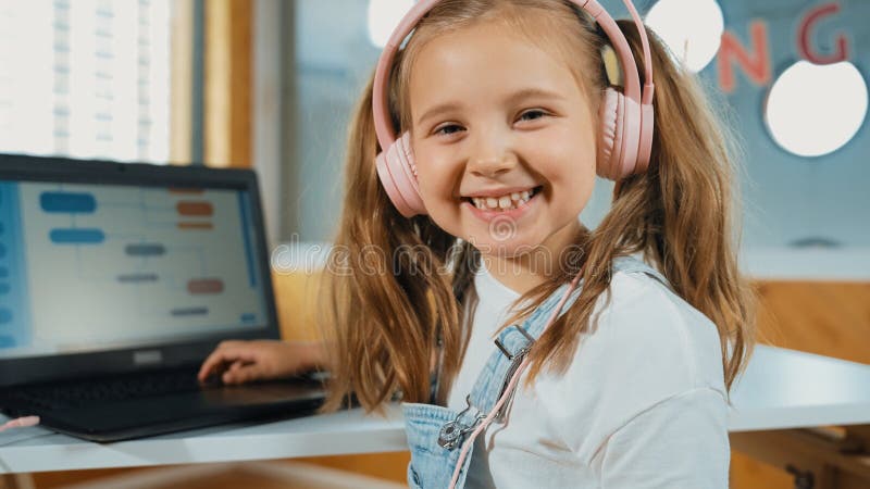 Smiling Girl Looking at Camera with Laptop Displayed Coding Program ...