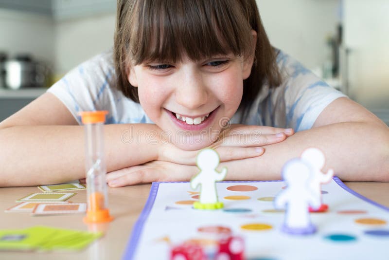 Smiling Girl Playing Generic Board Game at Home Stock Photo - Image of ...