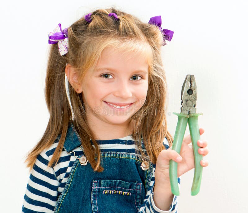 Smiling girl with pliers stock photo. Image of cute, blond - 27383924