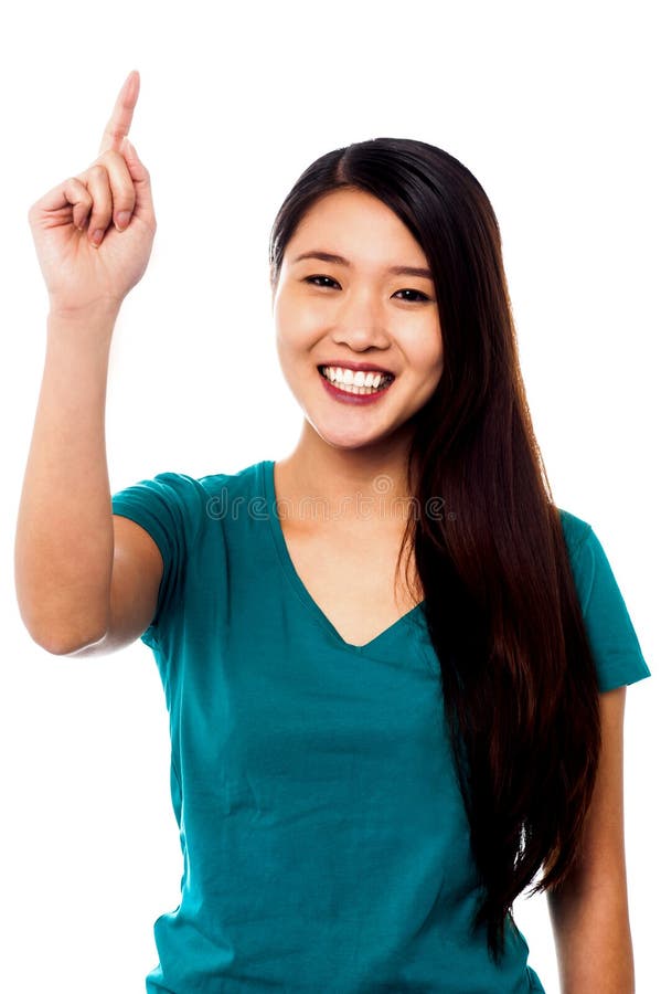 Smiling Girl Pointing Upwards Stock Image - Image of length, casual ...