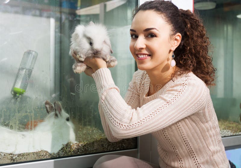 Girl posing with rabbit stock photo. Image of rabbit - 175676104