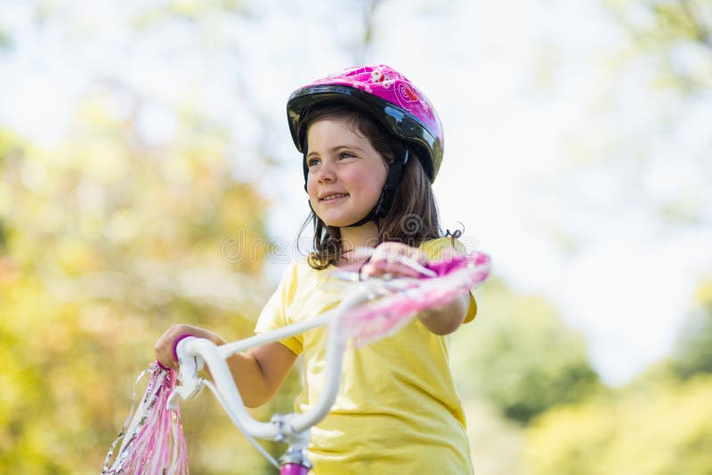 Smiling Girl Riding a Bicycle Stock Photo - Image of female, safety ...