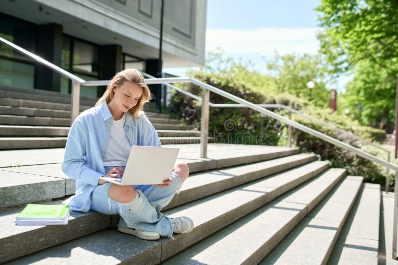 Smiling Girl Student Using Laptop Computer Outdoor in University Campus ...