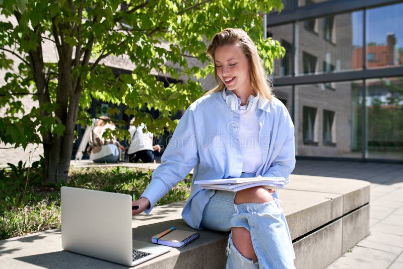Smiling Girl Student Using Laptop Studying Outdoor in University Campus ...
