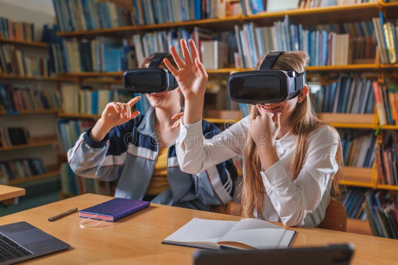 Smiling Girl Students Enjoying VR Experience in the School Library ...