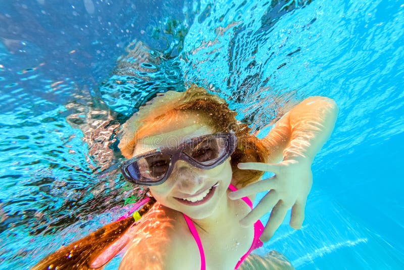 Smiling Girl Swimming Underwater In Pool Stock Image Image Of Bubbles