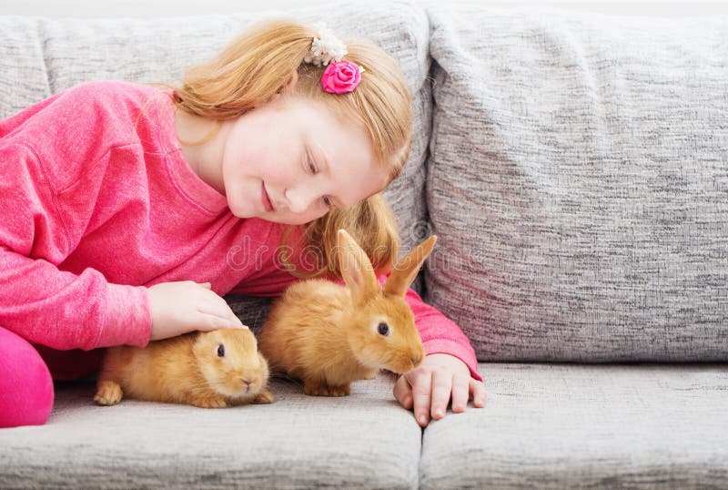 Smiling Girl with Two Rabbits Stock Photo - Image of person, childhood ...