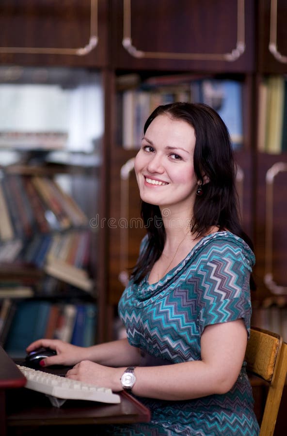 Smiling Girl Working on Computer Stock Image - Image of home, face ...